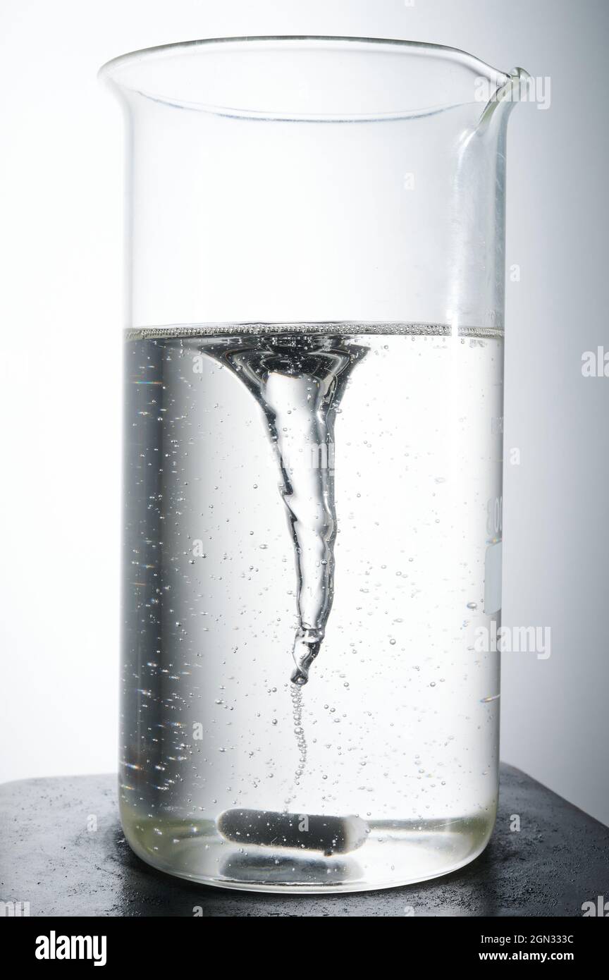 Transparent clean liquid wax in glass flask isolated close up Stock ...