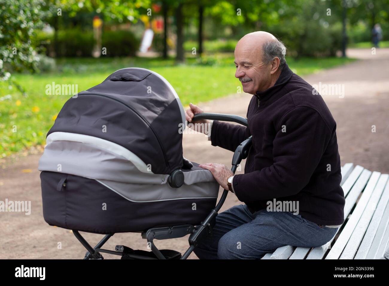Man pushing child in buggy hi-res stock photography and images - Alamy