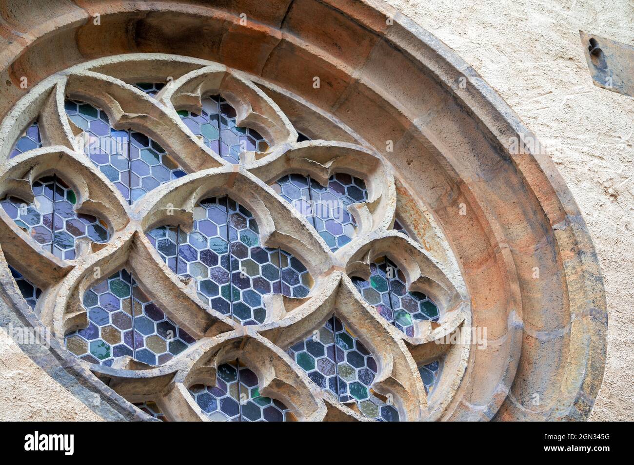 Close-up of a church facade with rose window (15th century) in ...