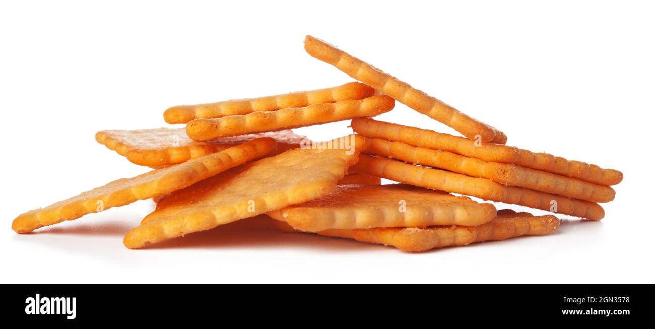 Pile of salted crackers isolated on white background Stock Photo - Alamy