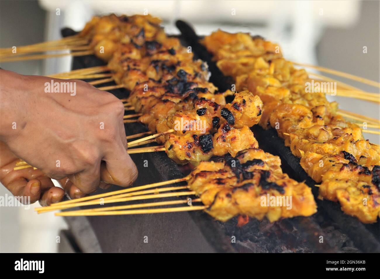 Traditional Malaysian barbeque dish called sate, served with spicy ...