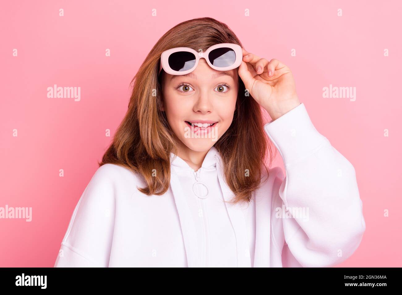 Portrait Of Attractive Amazed Cheerful Girl Touching Specs Isolated