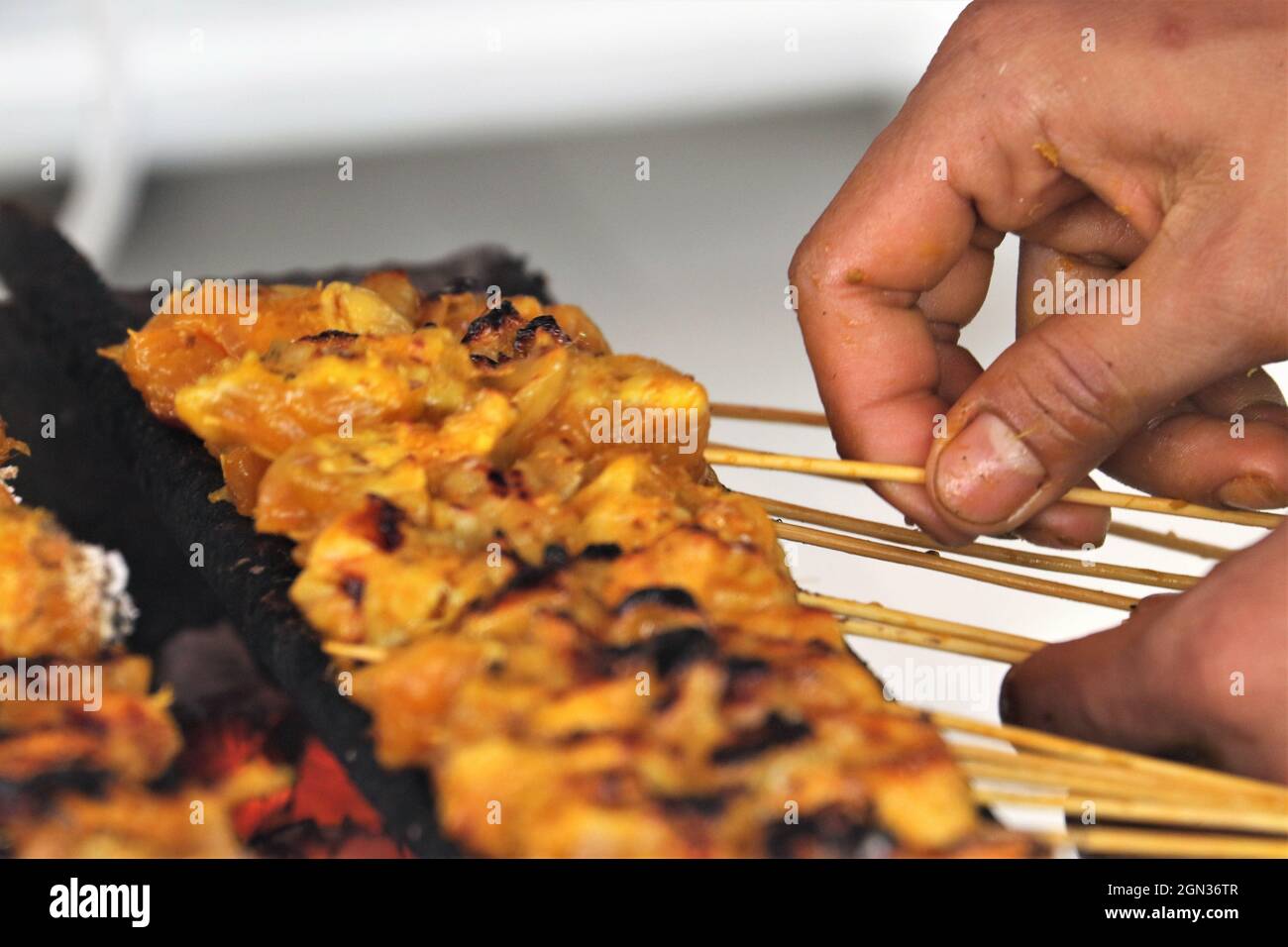 Traditional Malaysian barbeque dish called sate, served with spicy ...