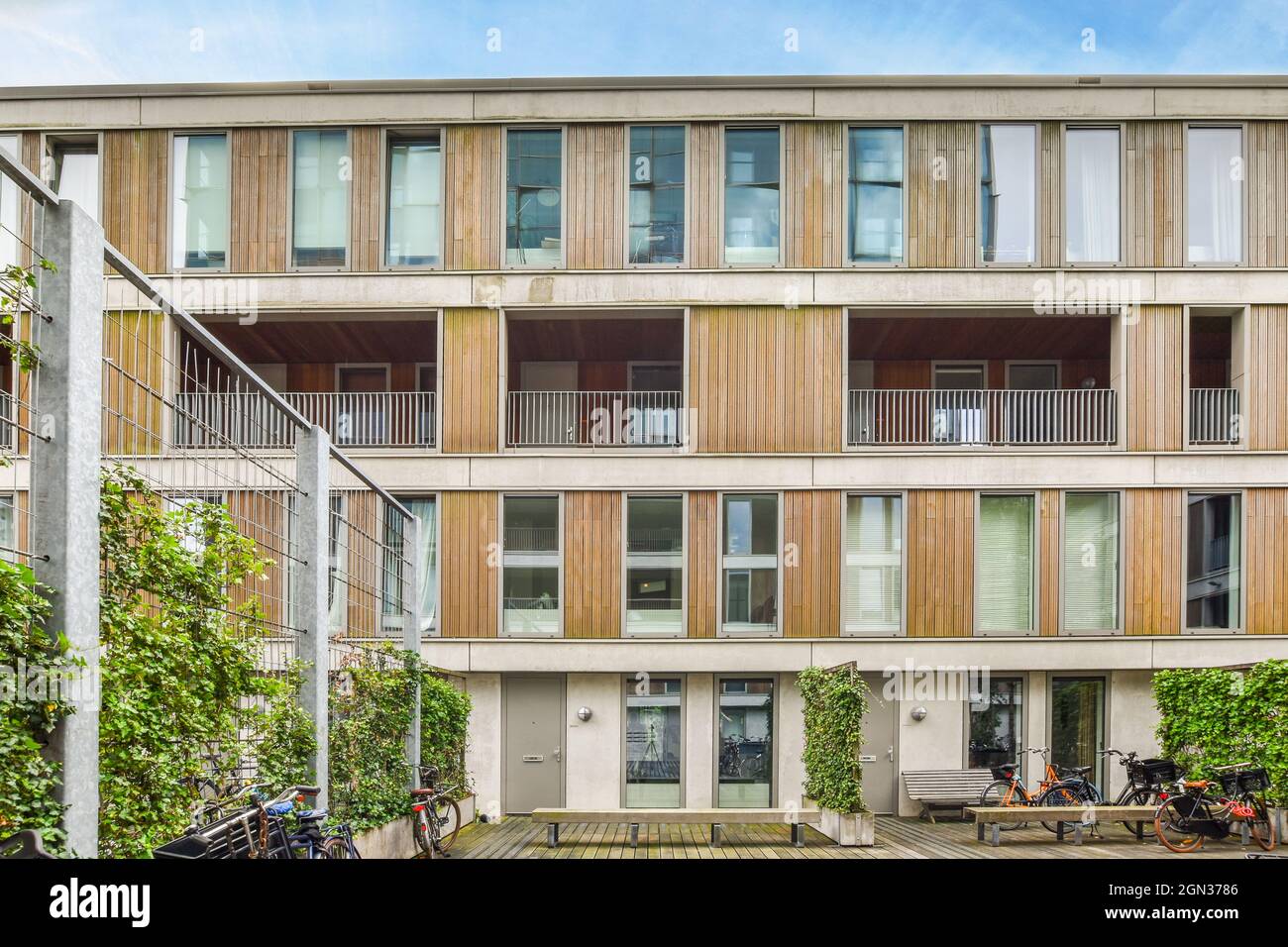 Exterior of building placed in residential district in city under blue ...