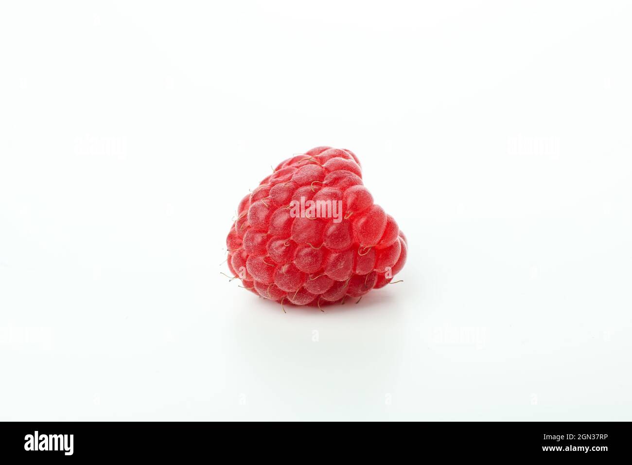 Red juicy raspberry, isolated on white background Stock Photo - Alamy