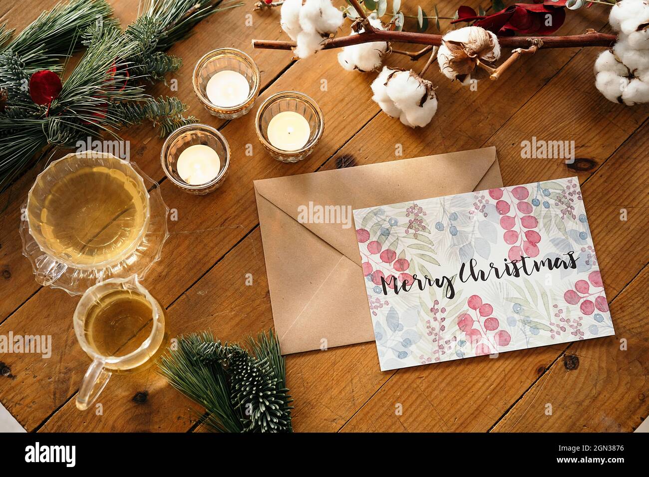 Top view of Christmas composition with colorful postcard with ...