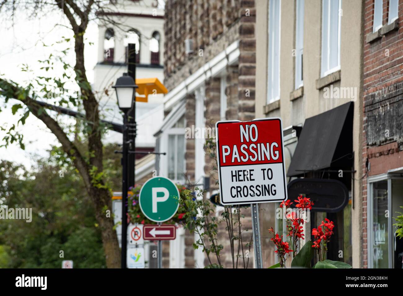 "No passing" and "Parking" road signs on the stre Stock Photo - Alamy