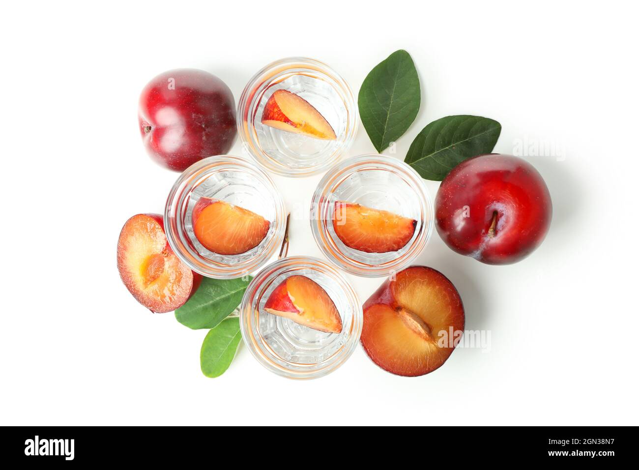 Plum vodka shots isolated on white background Stock Photo - Alamy