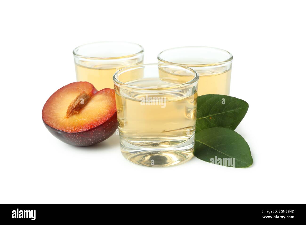 Plum vodka shots isolated on white background Stock Photo - Alamy