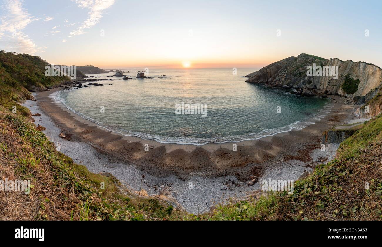 Spectacular view of rippled ocean and coast with mounts under cloudy ...