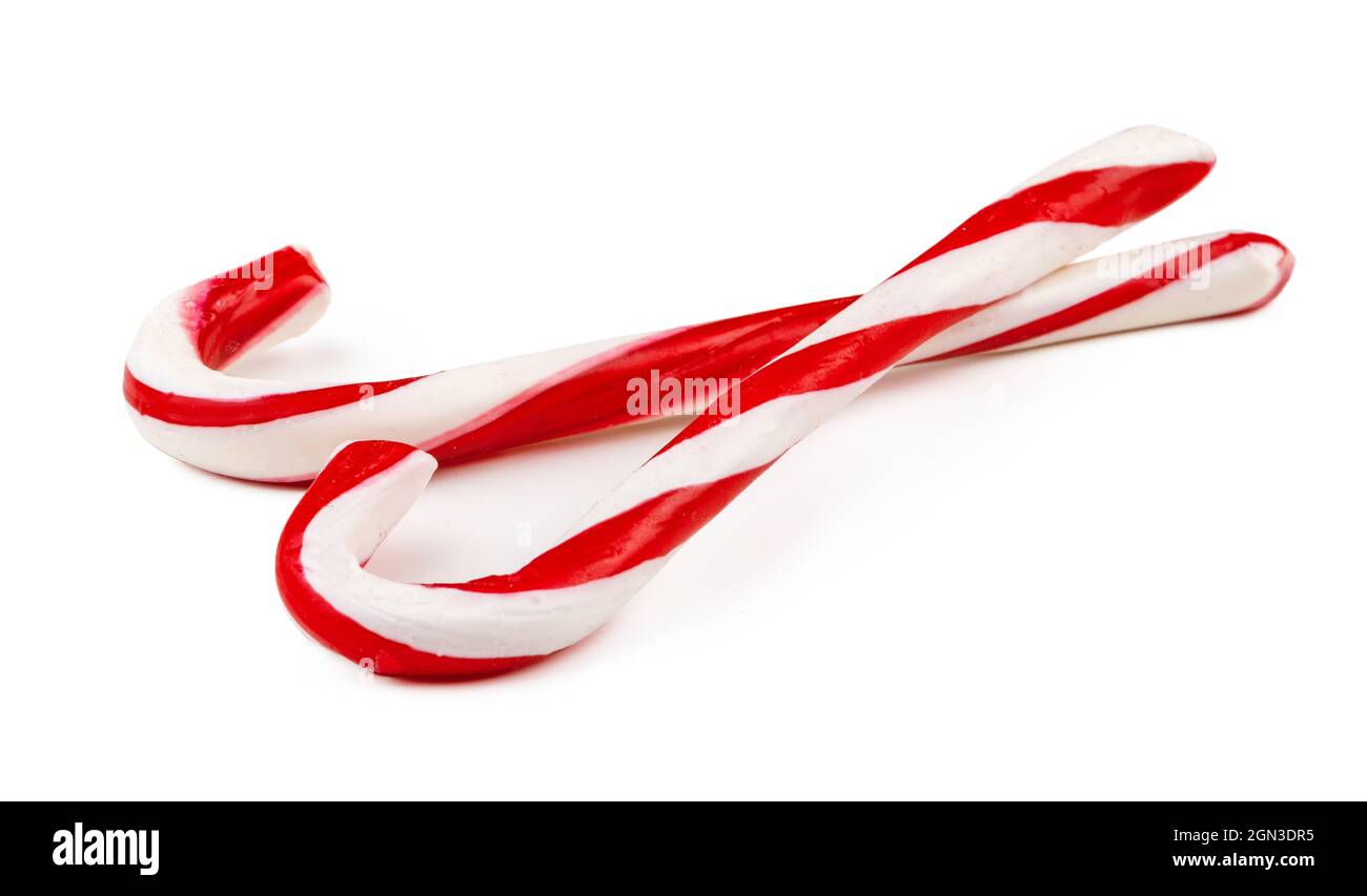 Two candy canes isolated on white background Stock Photo - Alamy