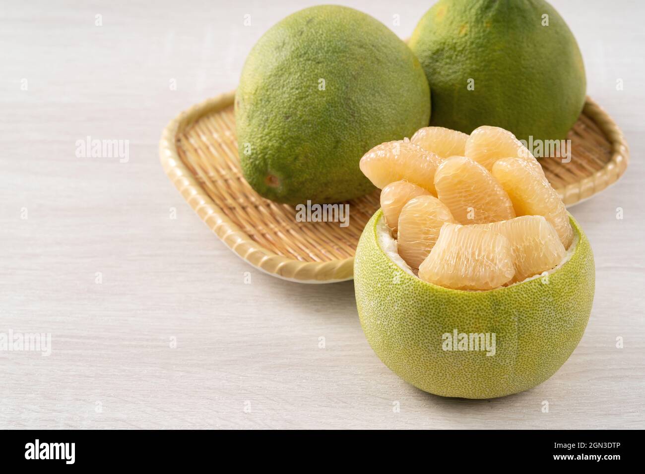 Close up of fresh peeled pomelo on wooden table background for Mid-Autumn Festival fruit Stock ...