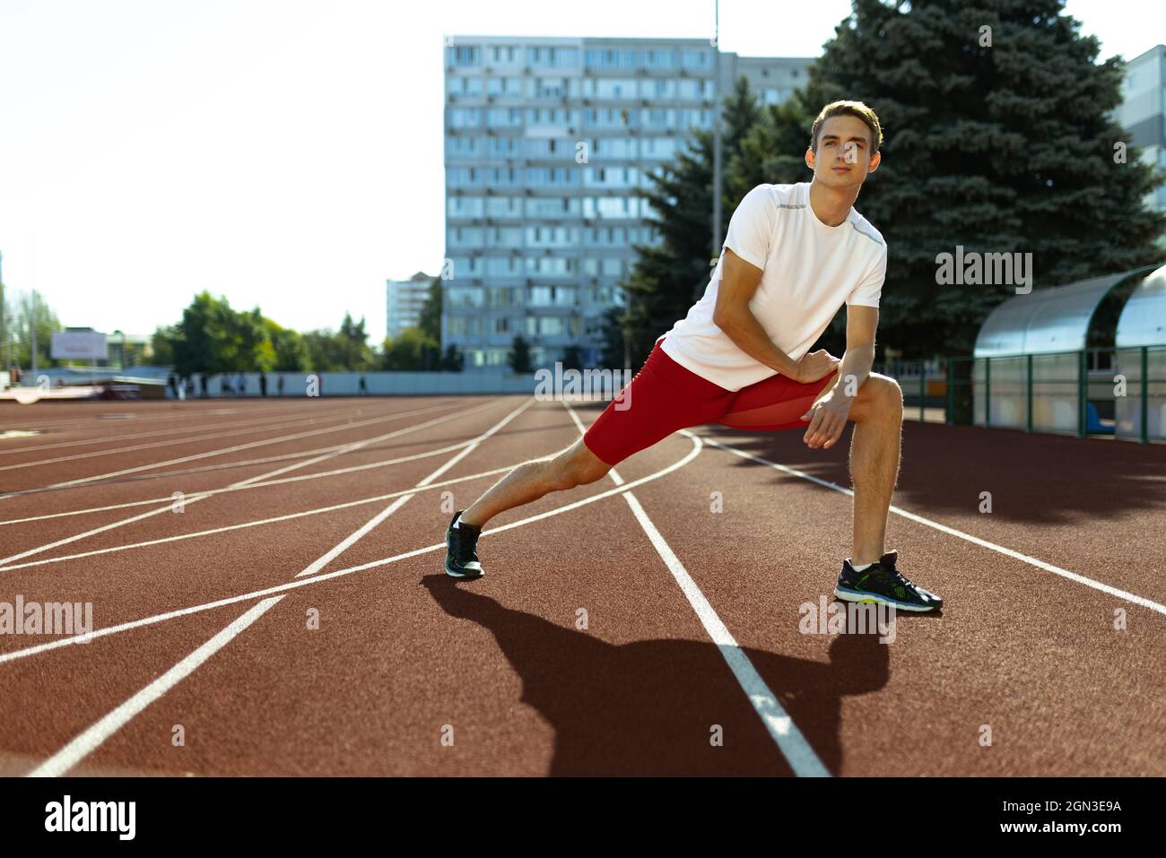 Young Caucasian sportive man, male athlete, runner practicing alone at ...