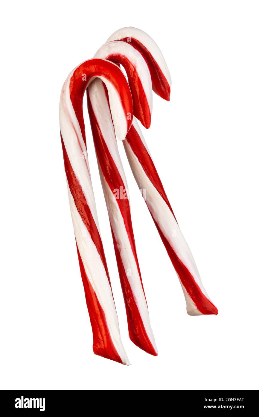 Stack of candy canes isolated on white background Stock Photo - Alamy