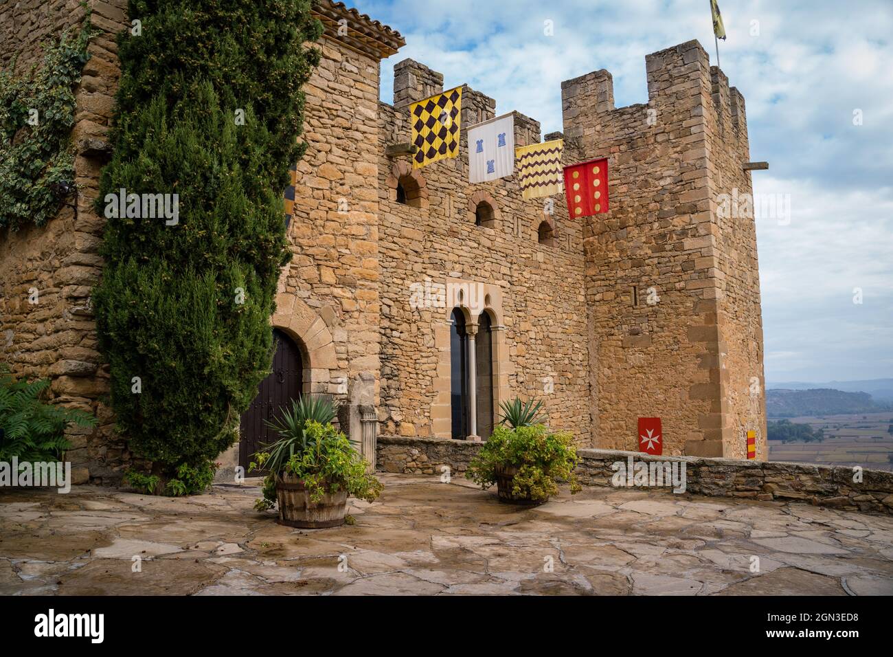 Montsonis castle with cloudy blue sky and medieval flags lleida ...