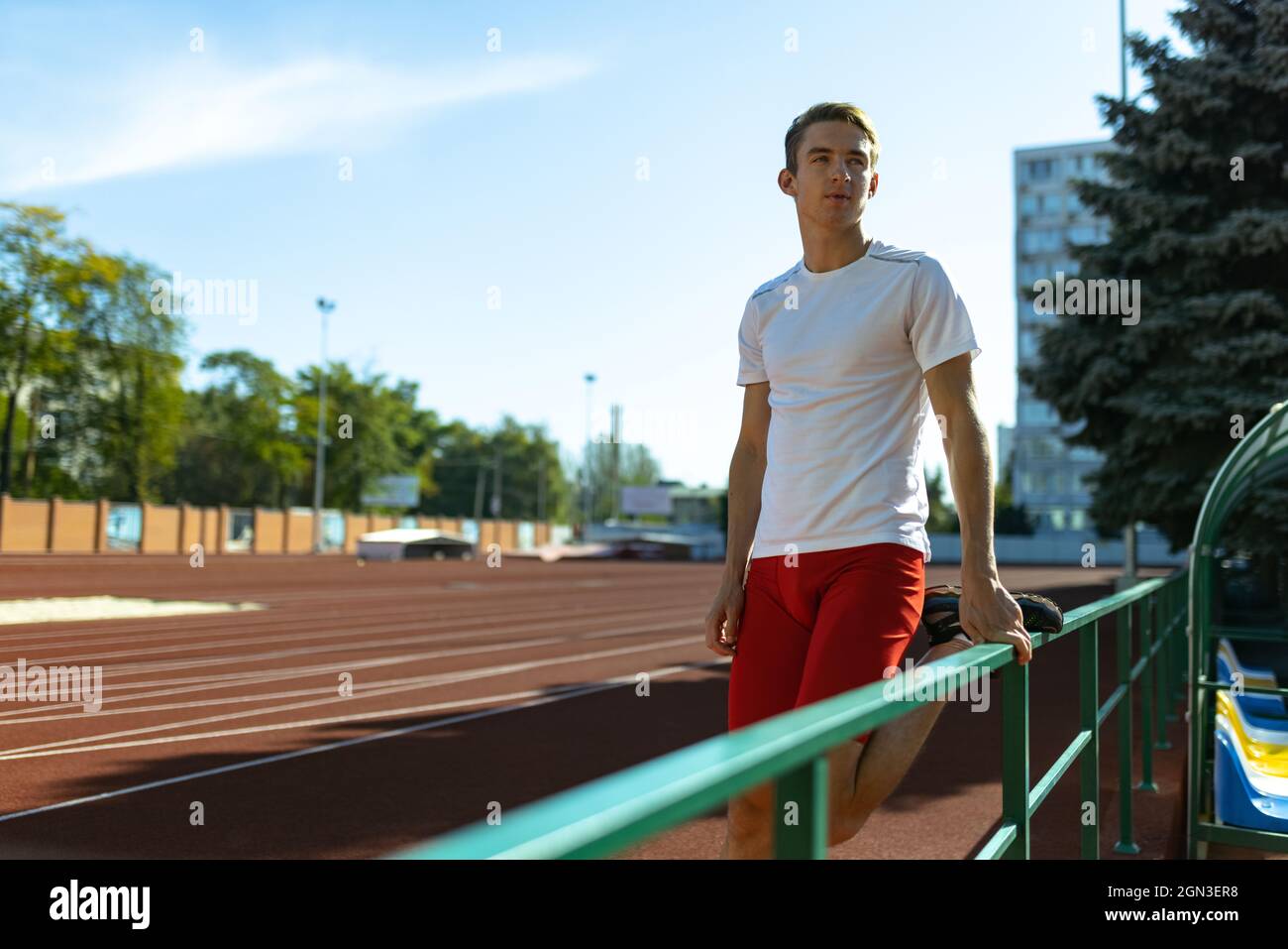 Young Caucasian sportive man, male athlete, runner practicing alone at ...