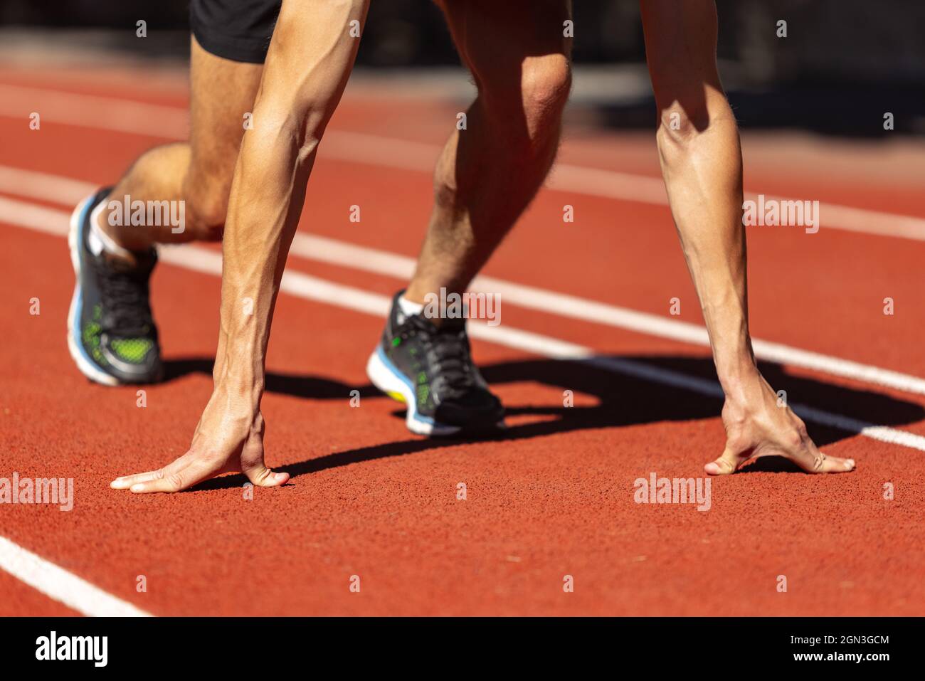 One young sportive man, male athlete, runner practicing alone before ...