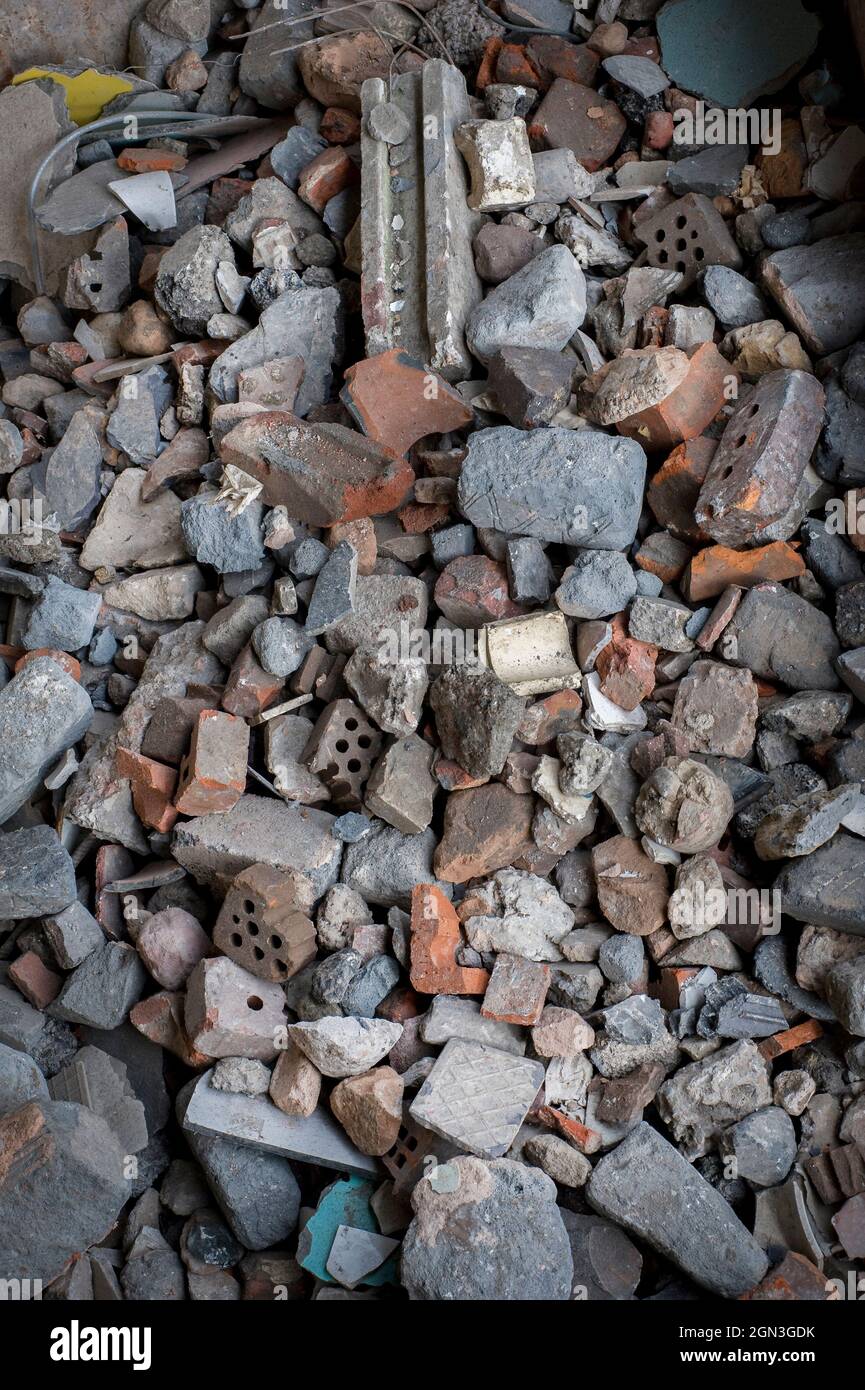 Piles of waste rubble at a materials recycling facility in England ...