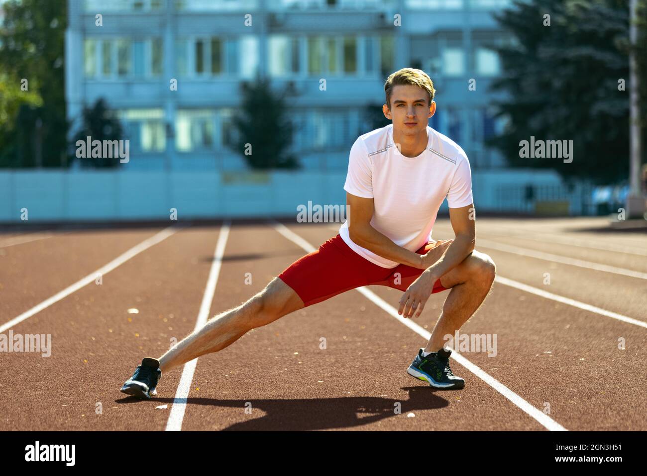 Young Caucasian sportive man, male athlete, runner practicing alone at ...