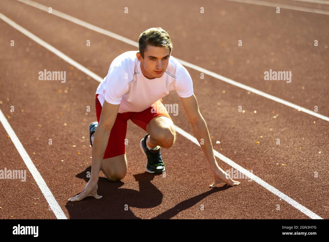 One young sportive man, male athlete, runner practicing alone before ...