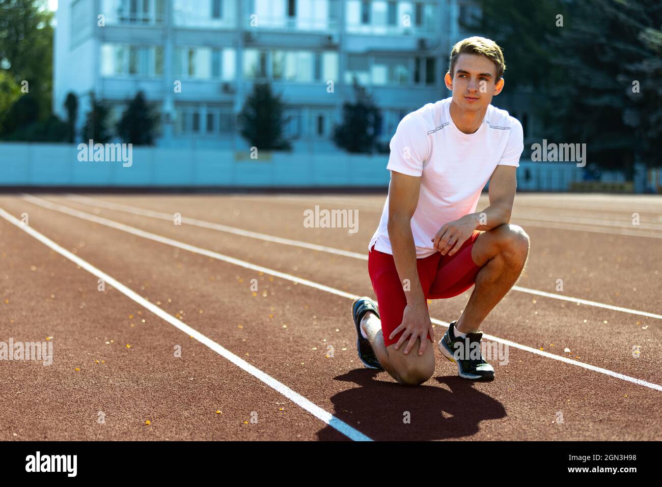 One young sportive man, male athlete, runner practicing alone before ...