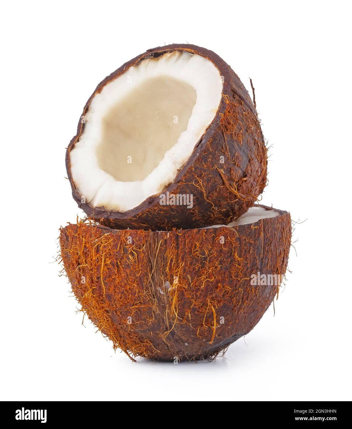 Coco nut halves isolated on white background Stock Photo - Alamy