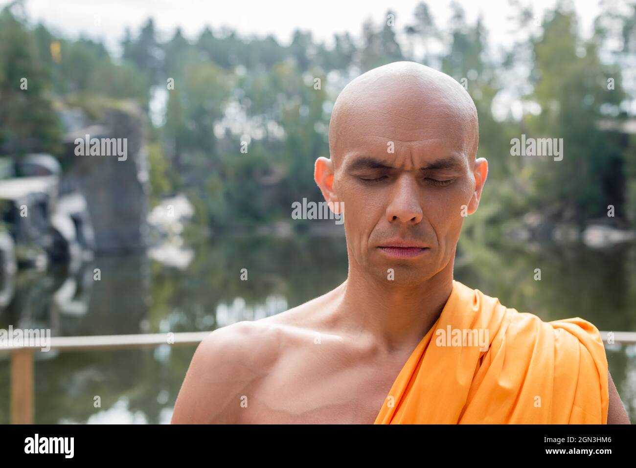 buddhist monk praying with closed eyes outdoors Stock Photo - Alamy