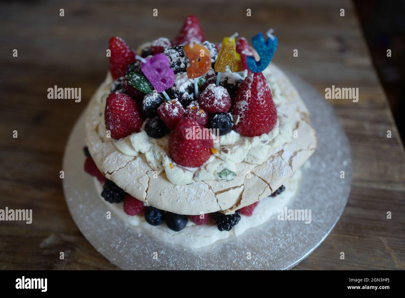 Delicious birthday cake with berries and cream Stock Photo - Alamy