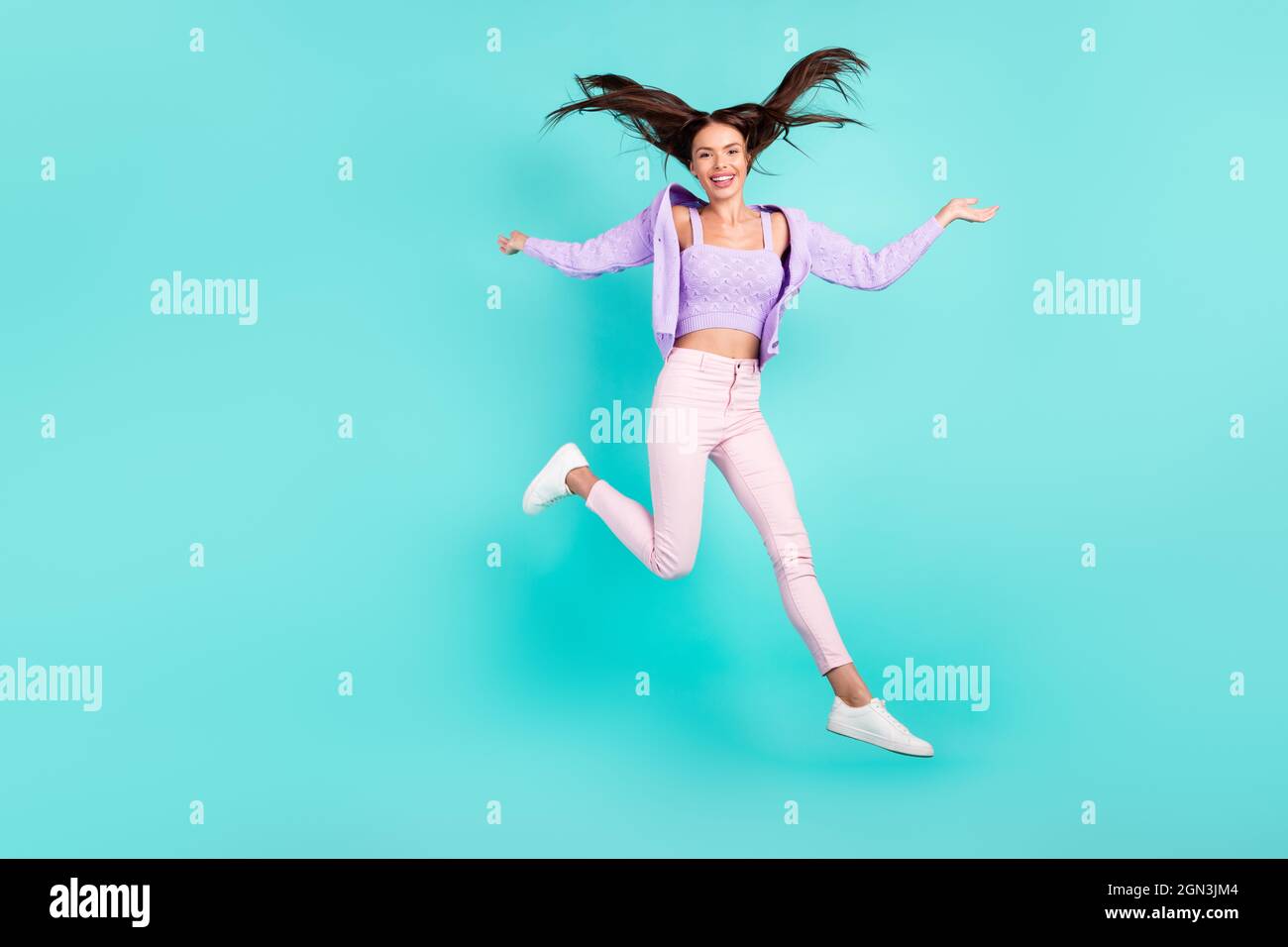 Photo of cute adorable young woman dressed purple clothes jumping high ...