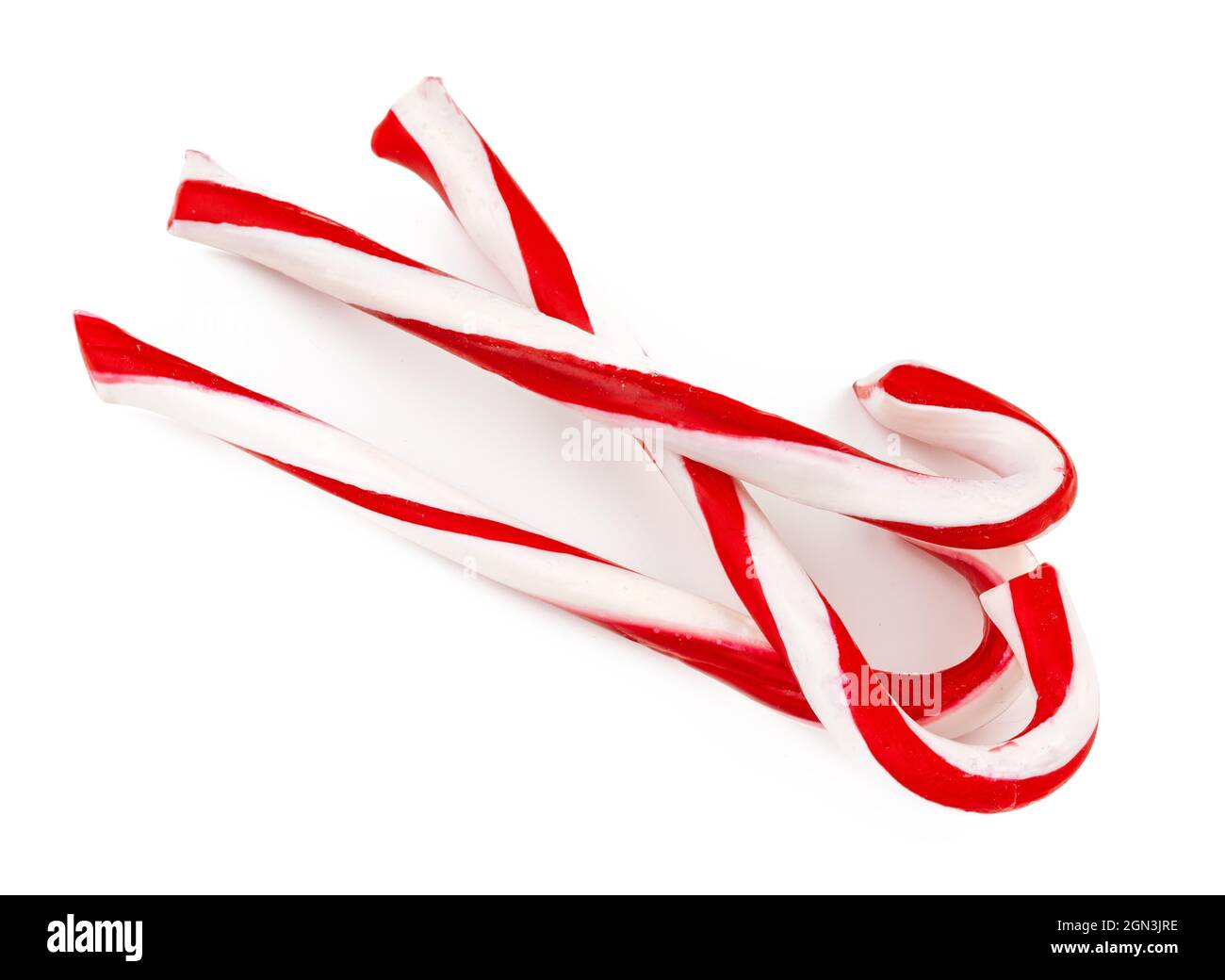 Stack of candy canes isolated on white background Stock Photo - Alamy