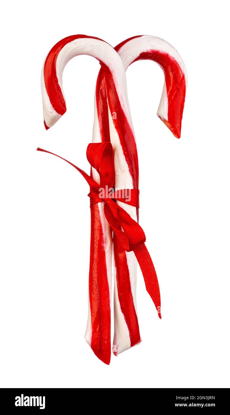 Two candy canes isolated on white background Stock Photo - Alamy