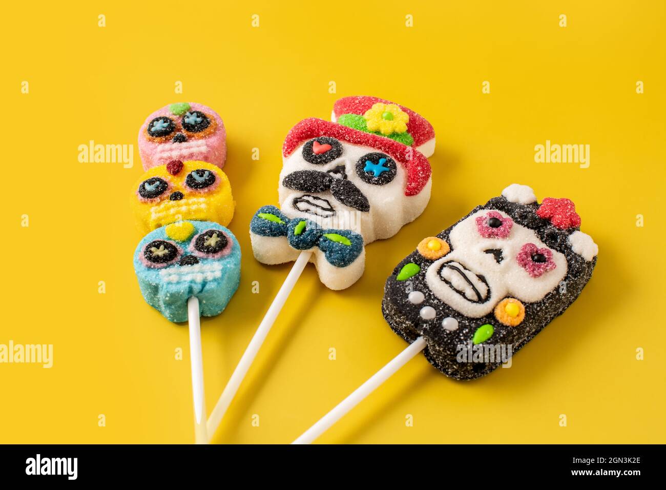 candy-skull-lollipops-on-yellow-background-stock-photo-alamy