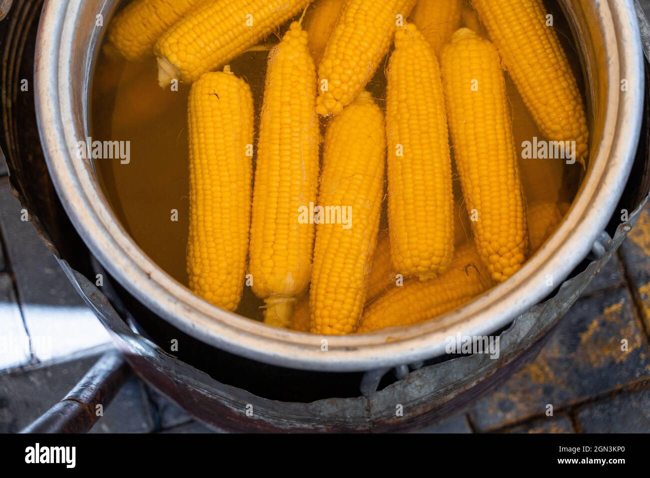Boiled corn. Cooking corn process in Turkish market, healthy street ...