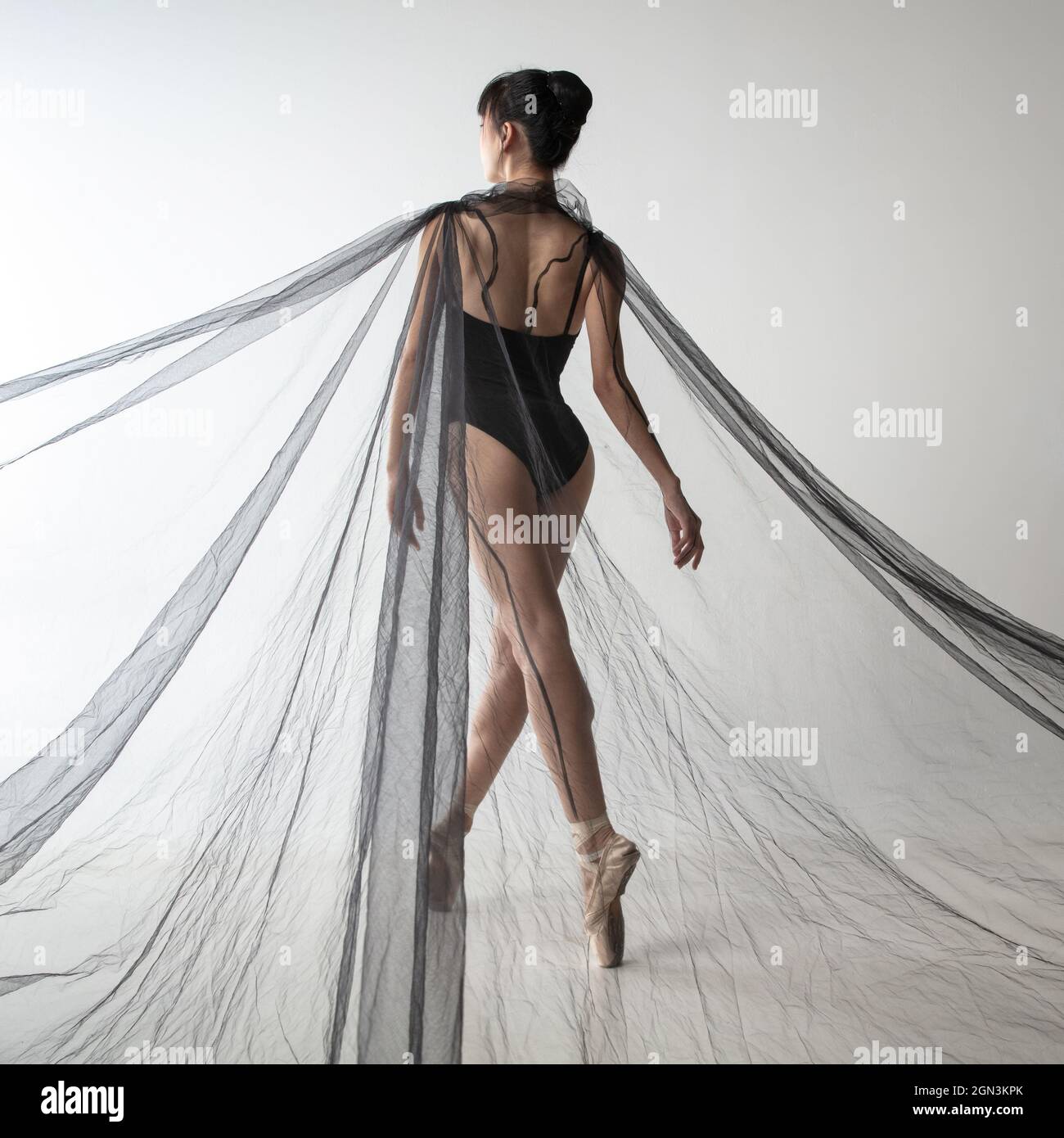 Portrait of young adorable Japanese ballerina dancing with transparent ... Portrait of young adorable Japanese ballerina dancing with transparent ...