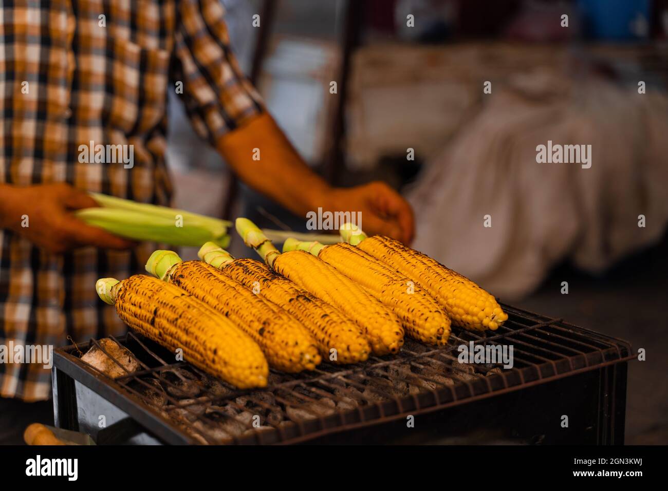 Fried corn on the grill on street. Healthy street food in Turkish ...
