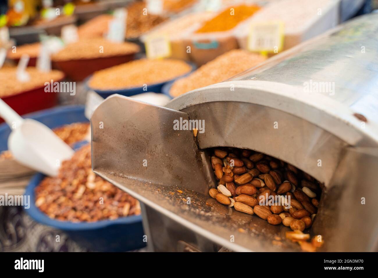 Roasting and blanching peanuts. Process of peeling peanuts in machine ...
