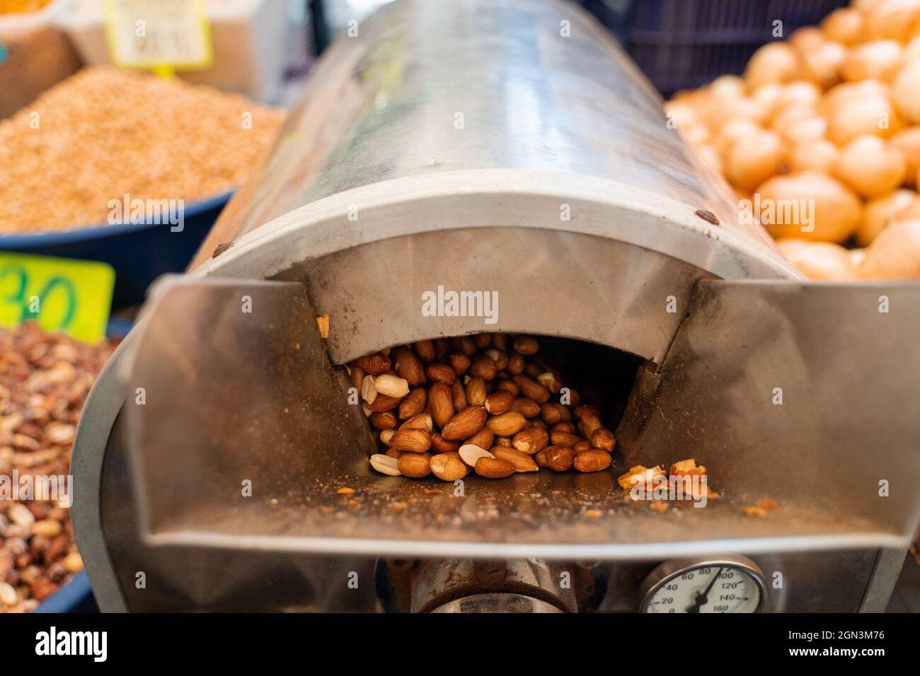 Roasting and blanching peanuts. Process of peeling peanuts in machine ...