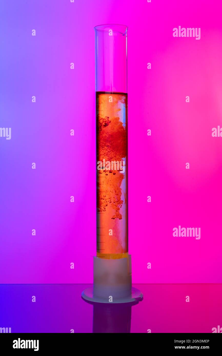 Laboratory glass tubes with chemicals on bright pink background Stock ...