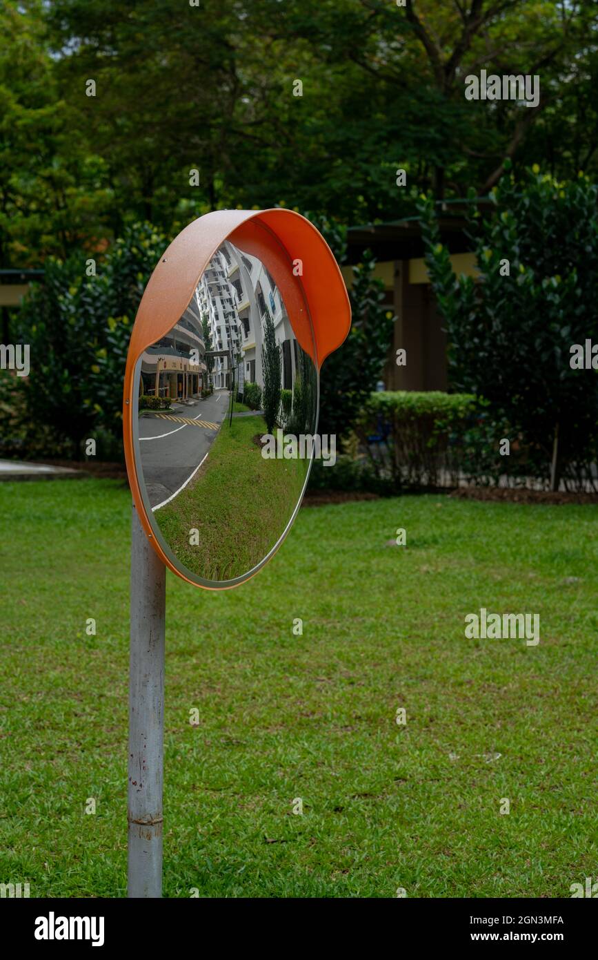 Reflection of residential buildings and carpark on road mirror Stock ...