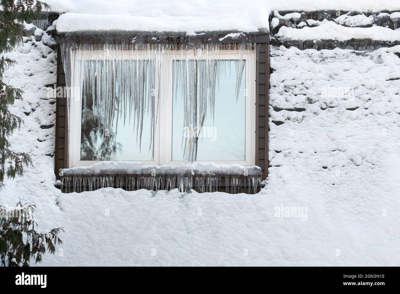 Icicles on the window of the house on a frosty day Stock Photo - Alamy