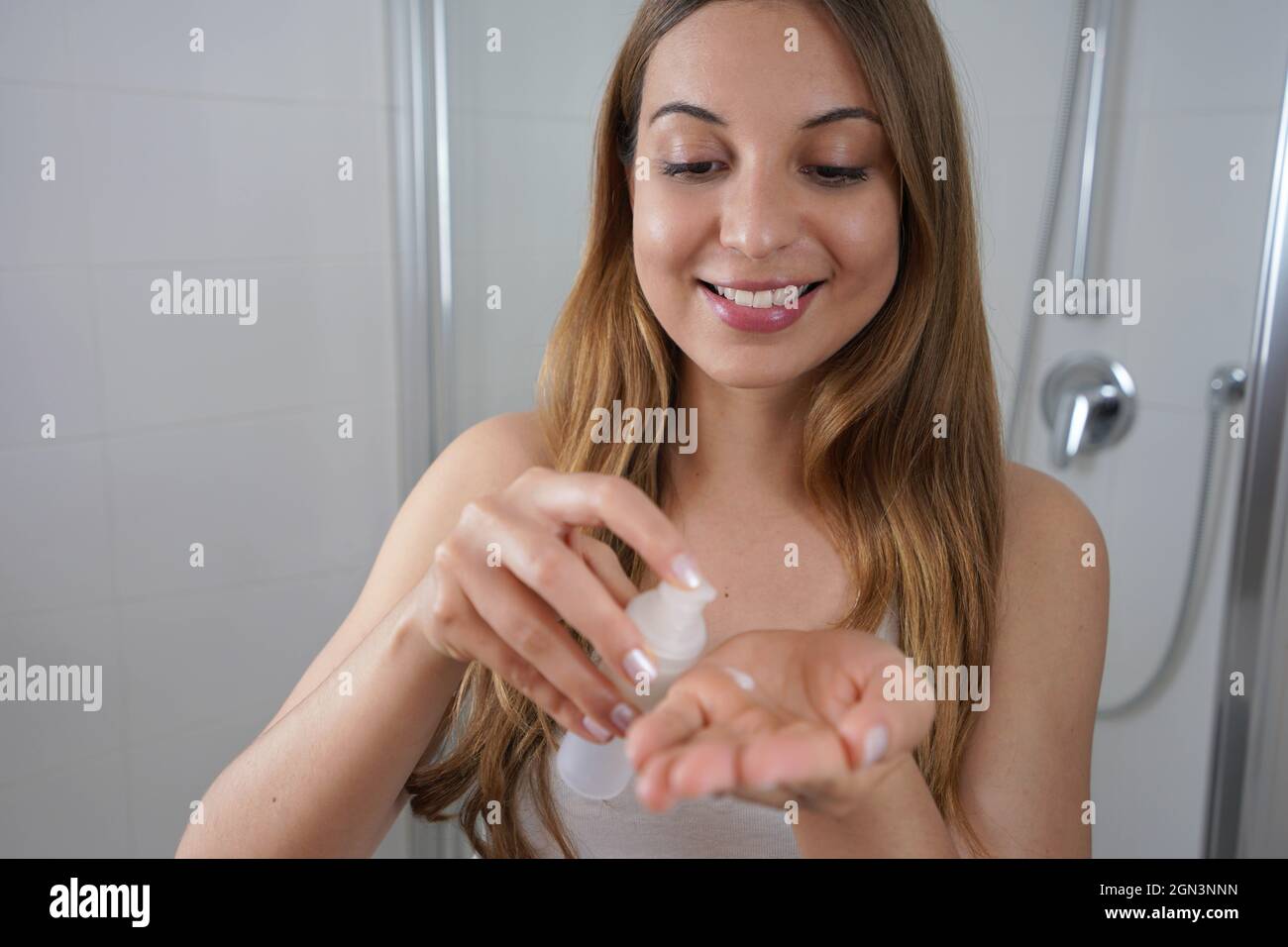 Serum, moisturizing, face lotion. Beautiful girl applying a serum ...
