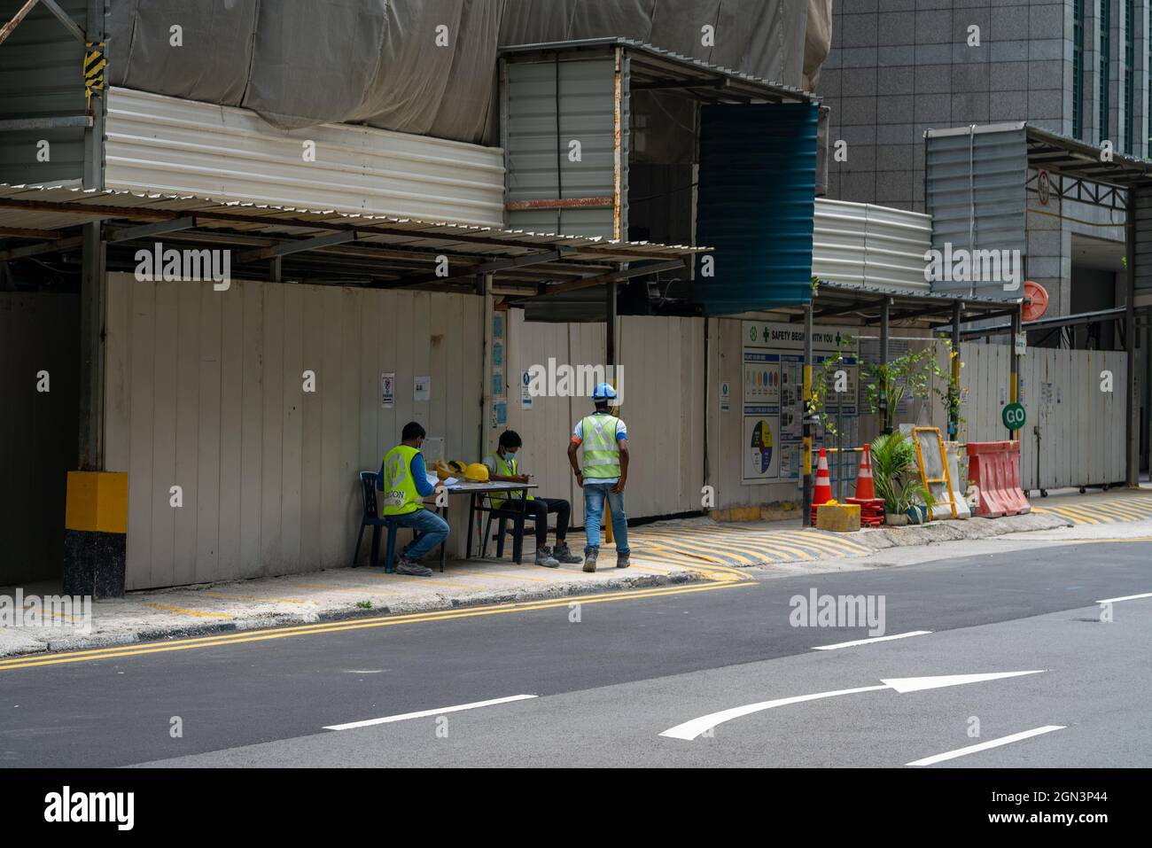 SINGAPORE, SINGAPORE - Sep 09, 2021: Construction workers outside a ...