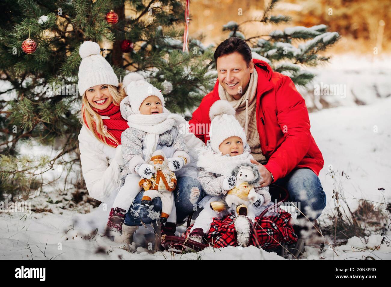 A large family with children at the Christmas tree on the street Happy ...