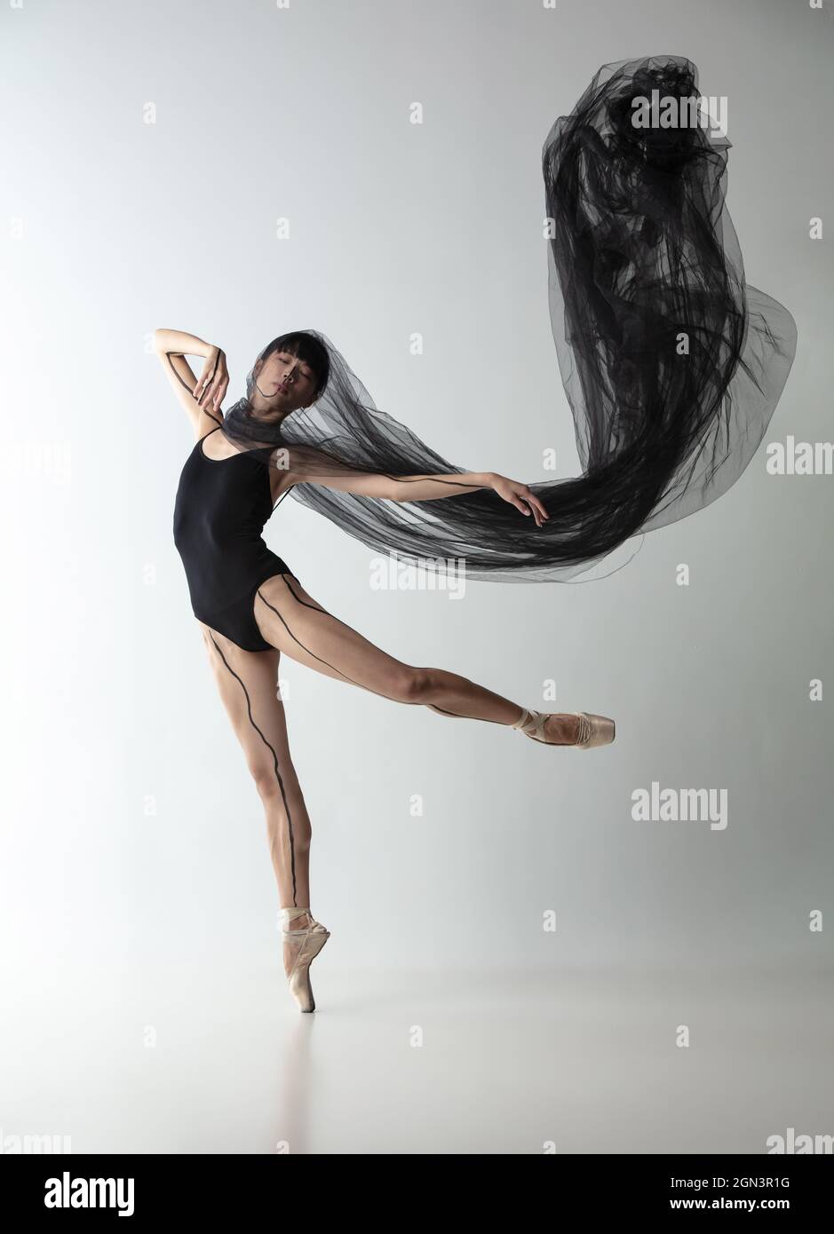 Portrait of young adorable Japanese ballerina dancing with transarent ... Portrait of young adorable Japanese ballerina dancing with transarent ...