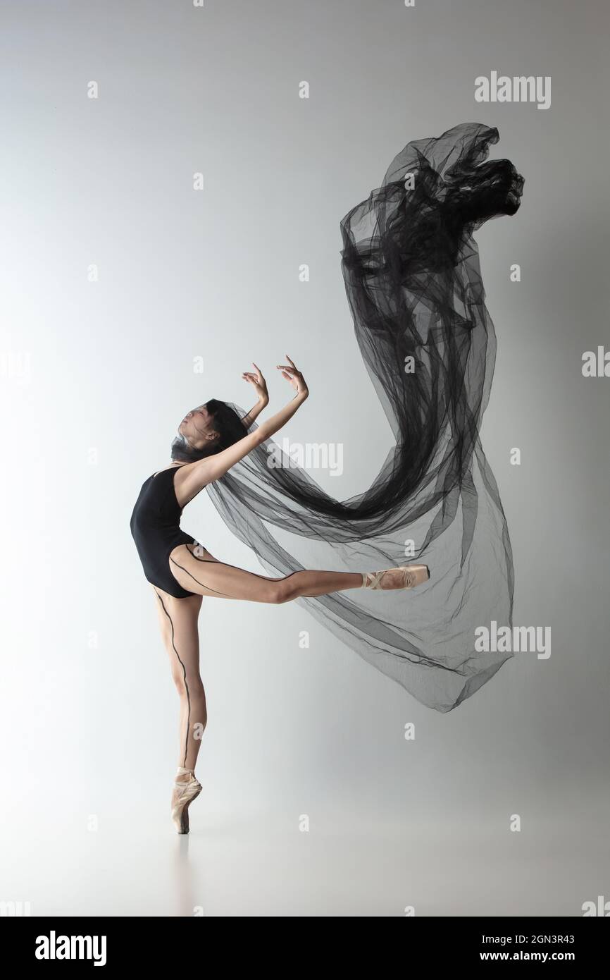 Portrait of young adorable Japanese ballerina dancing with transarent ... Portrait of young adorable Japanese ballerina dancing with transarent ...