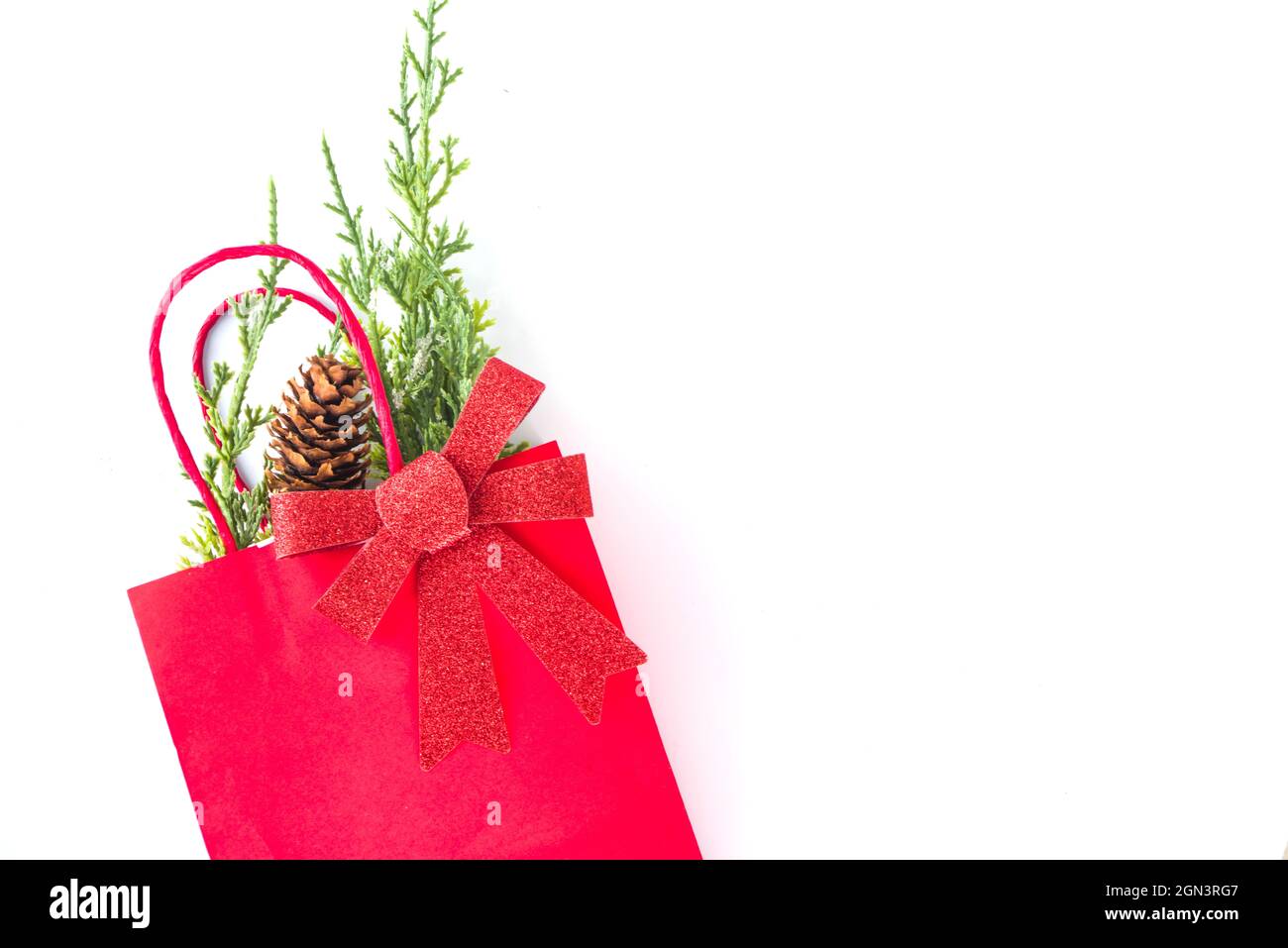 Red and green shopping bags with Christmas decoration, fir tree ...