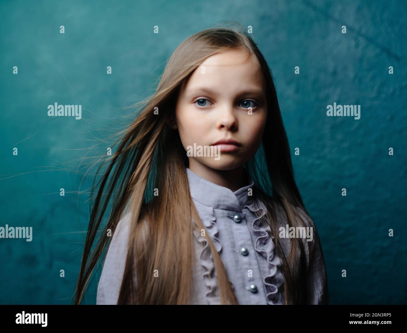 little girl long hair in dress posing isolated background Stock Photo - Alamy