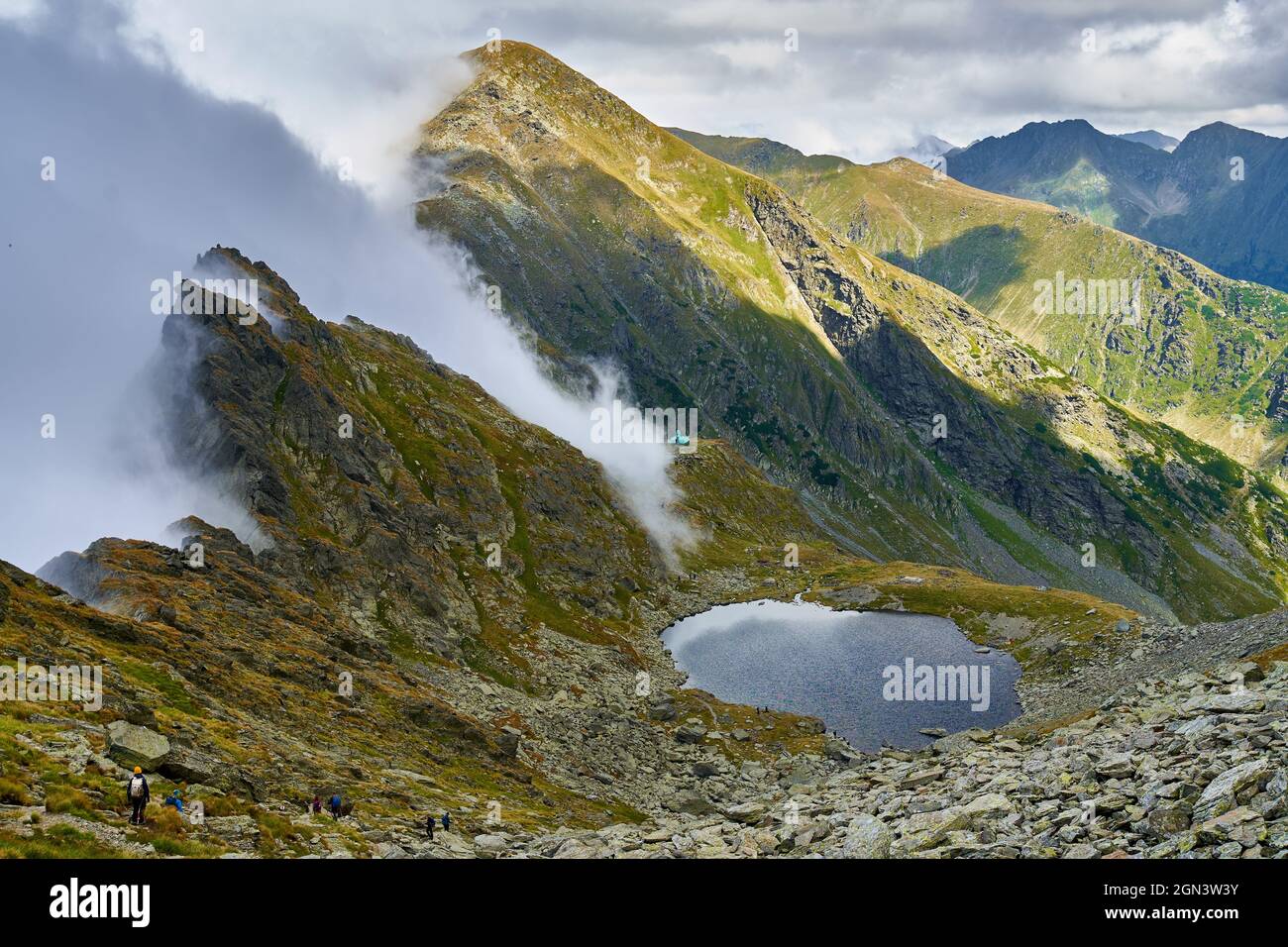 Landscape with the glacial lake Caltun in Fagaras mountain range ...