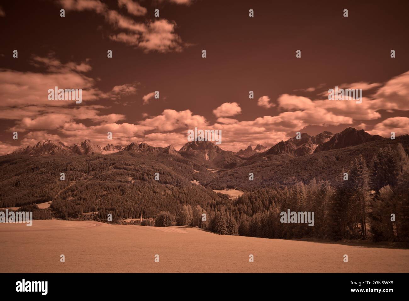 Peaks of the mountains of the Dolomites turned red. Infrared photo ...