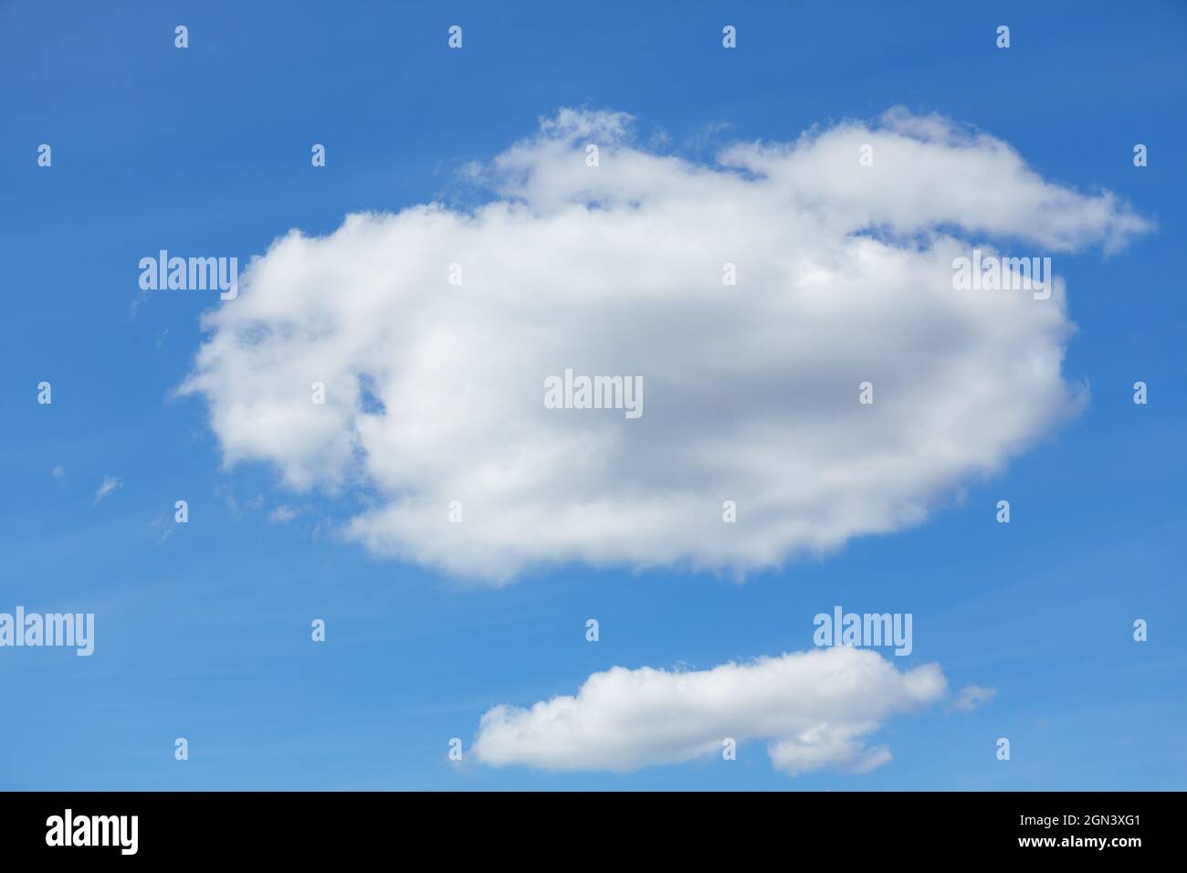 Typical white cloud on the blue sky . Summer day heaven Stock Photo - Alamy